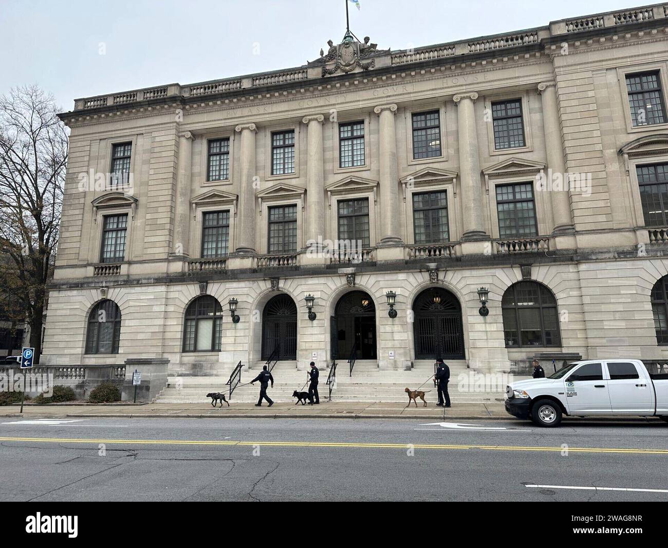 Police dogs sniff the outside of the Pulaski County courthouse in ...