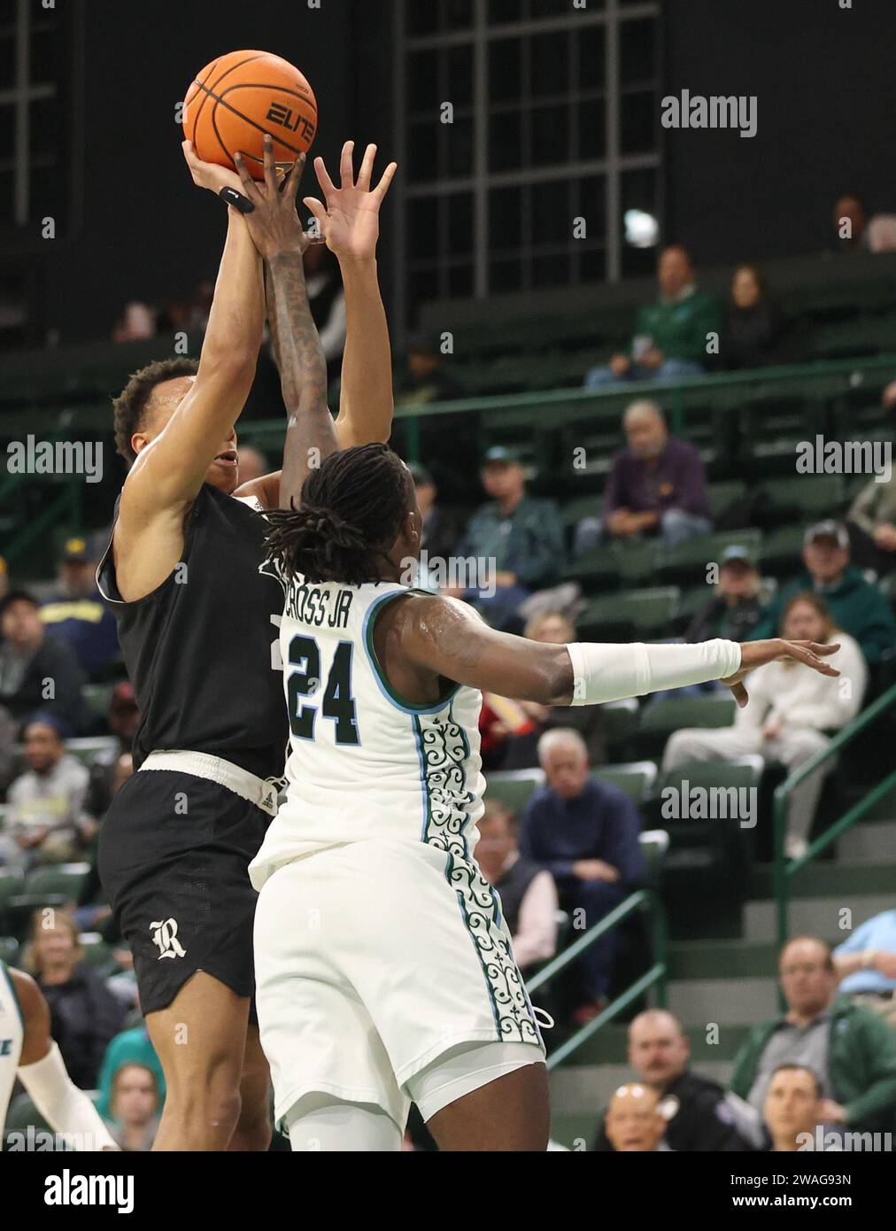 New Orleans, USA. 03rd Jan, 2024. Tulane Green Wave forward Kevin Cross (24) tries to block Rice ...