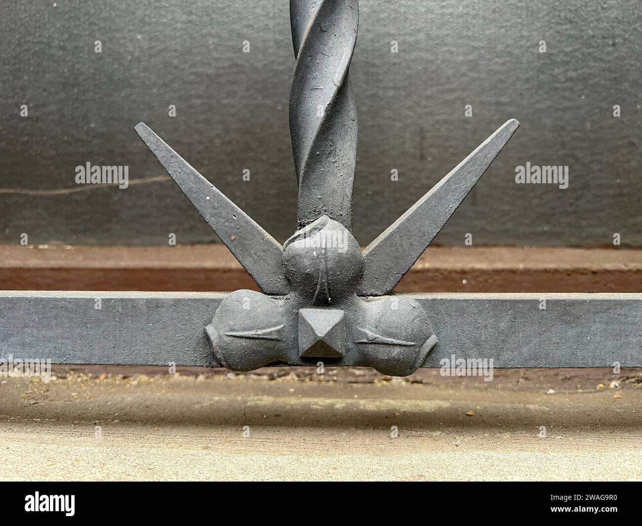 A close-up shot of an ornate metal window guard detail Stock Photo - Alamy