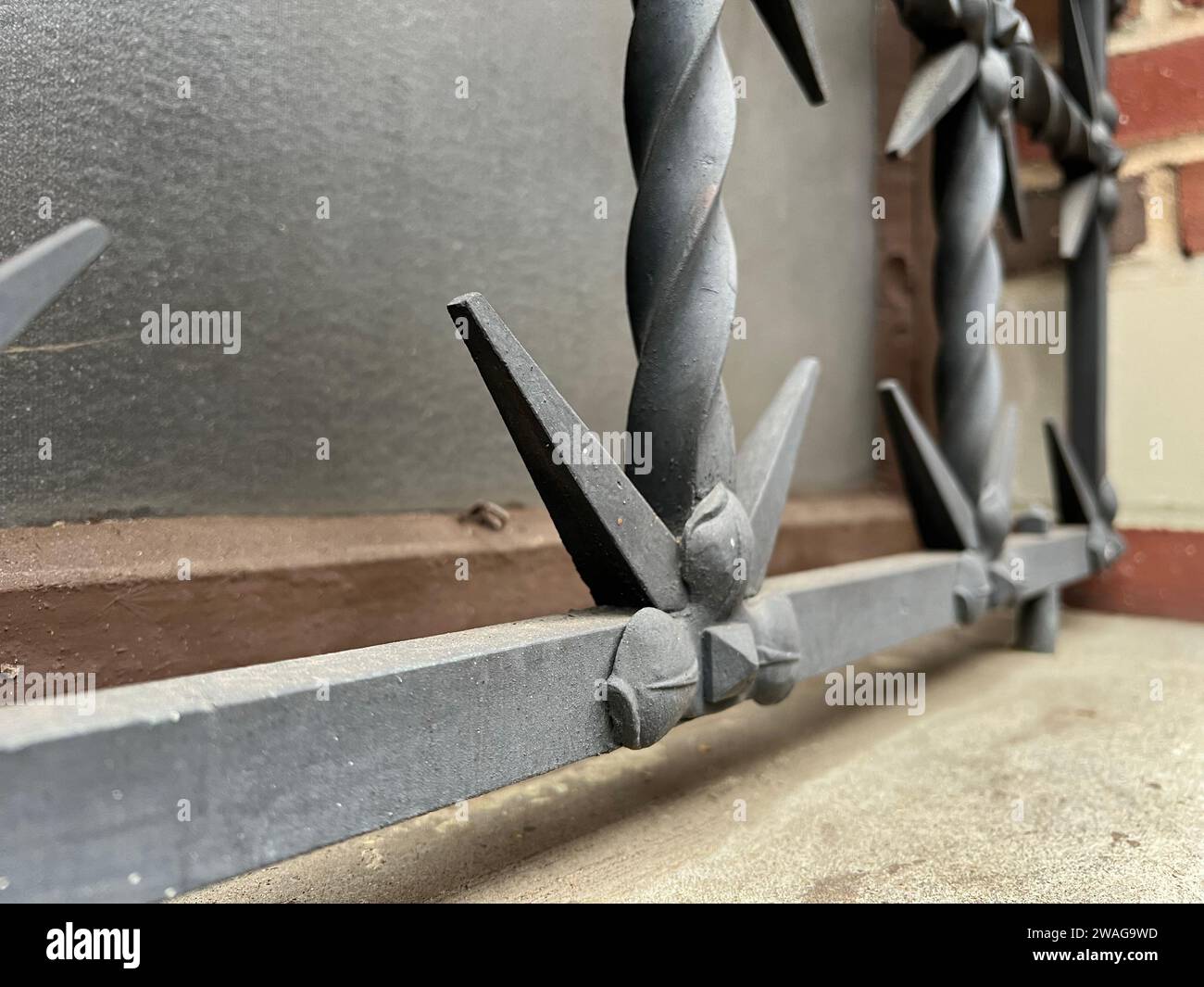 A close-up shot of an ornate metal window guard Stock Photo - Alamy