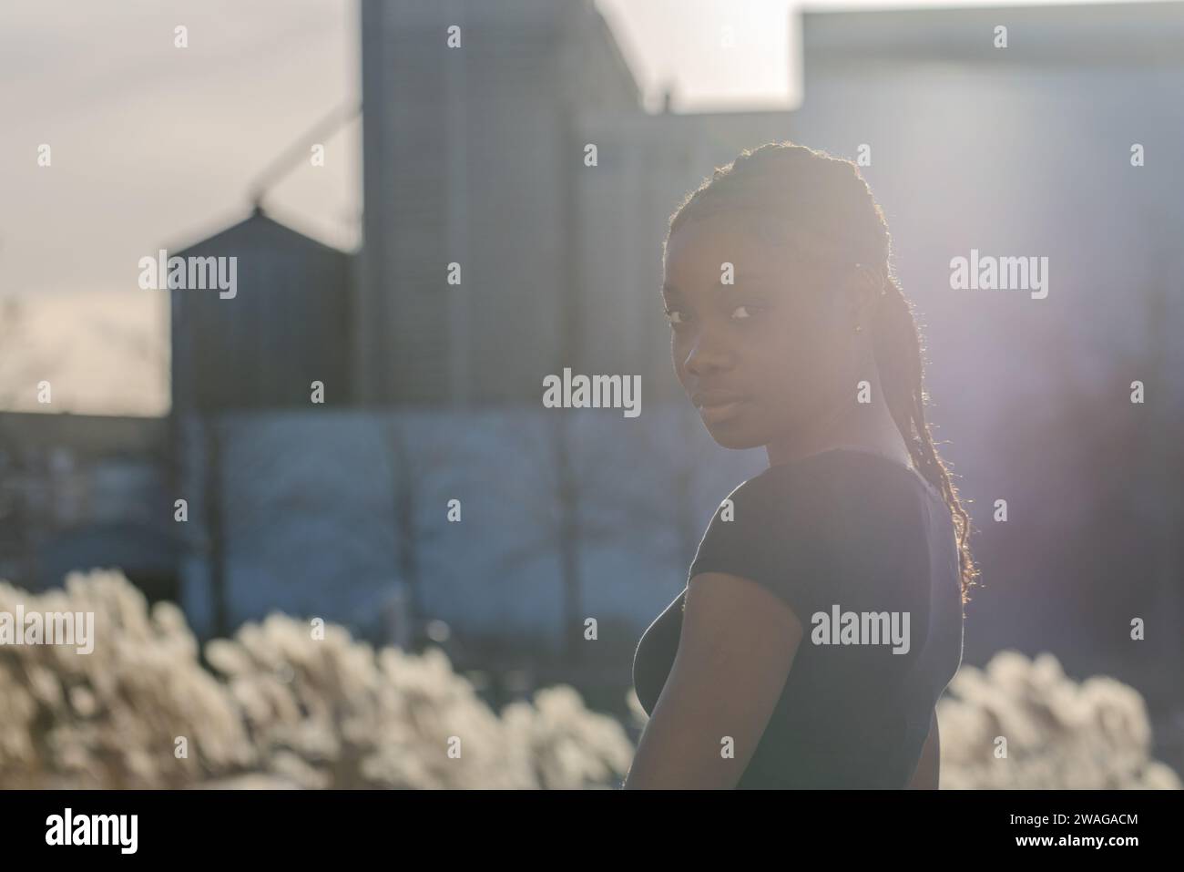 Glowing sky behind figure in hi-res stock photography and images - Alamy