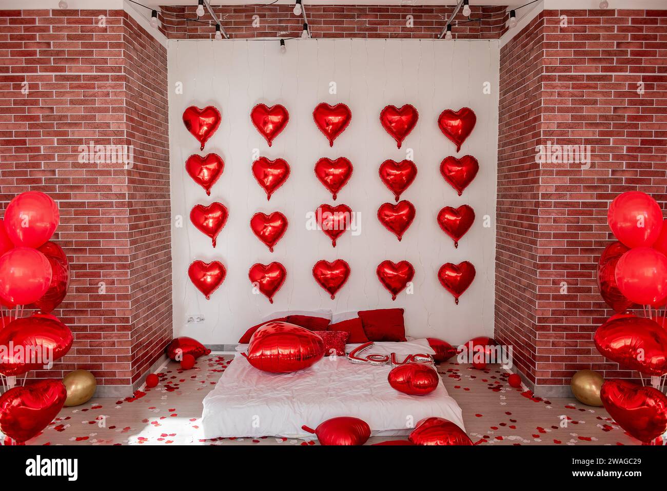 Loft interior in festive style for Valentines Day. Brick walls white ...