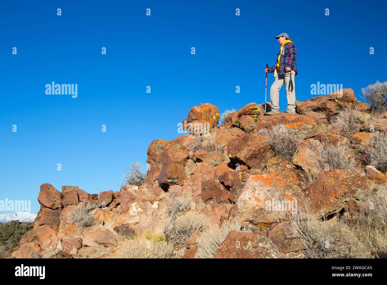 Hiker on scenic overlook, Hickison Petroglyphs Recreation Area, Mount ...