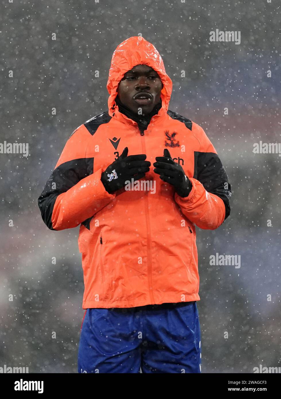 Crystal Palace's Tyrick Mitchell warming up in the rain before the ...