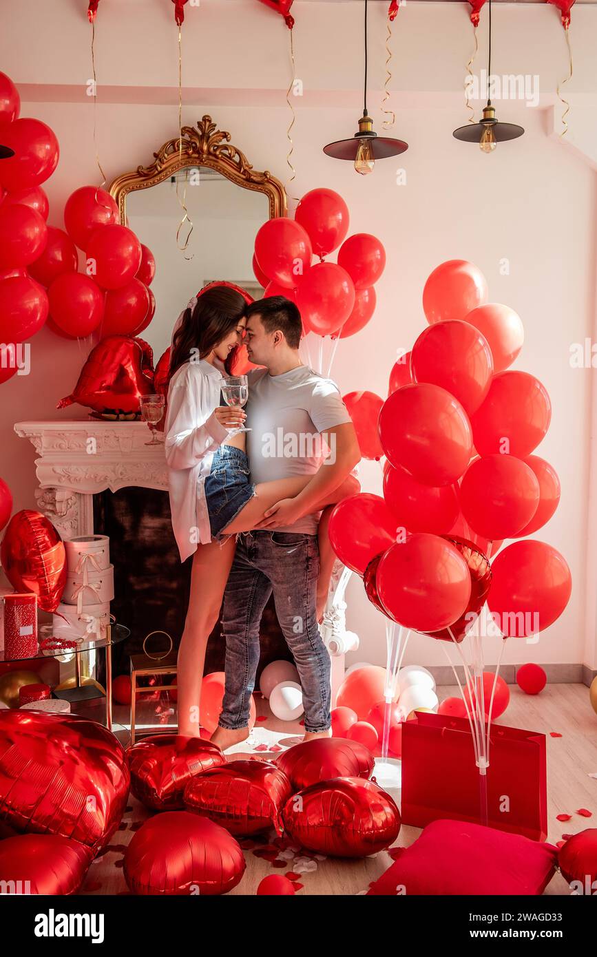 Joyous moment between dancing young couple celebrating with toast ...