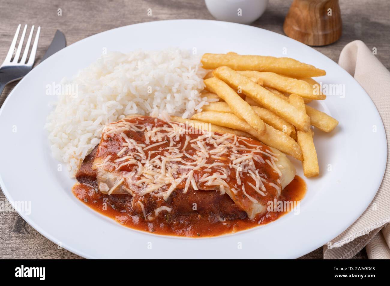 Parmegiana beef, rice and french fries. Typical brazilian executive ...