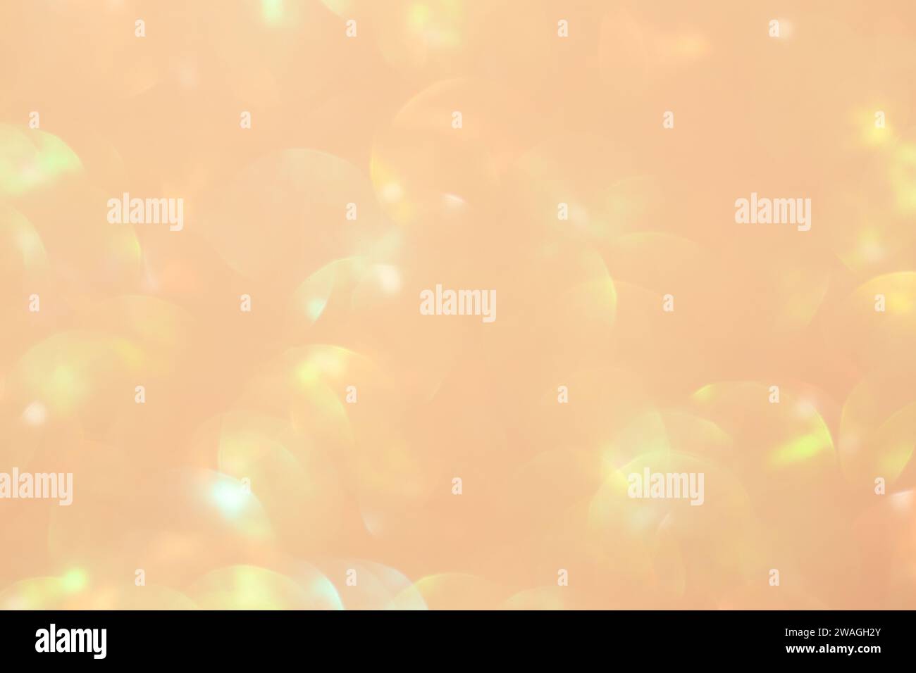 Peach colored background with blurred holiday lights. Showcasing the ...