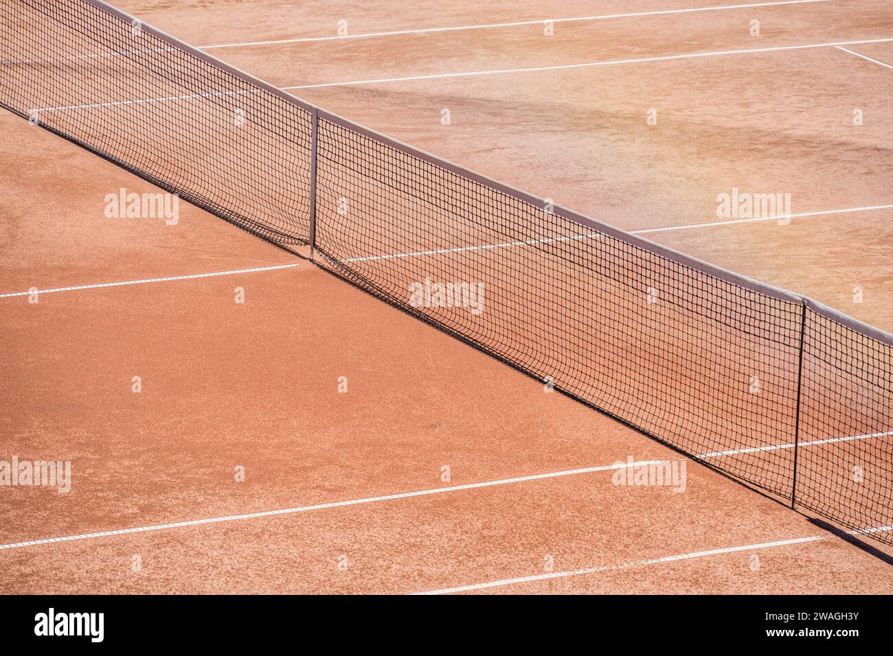 View with a net on the clay tennis court Stock Photo - Alamy