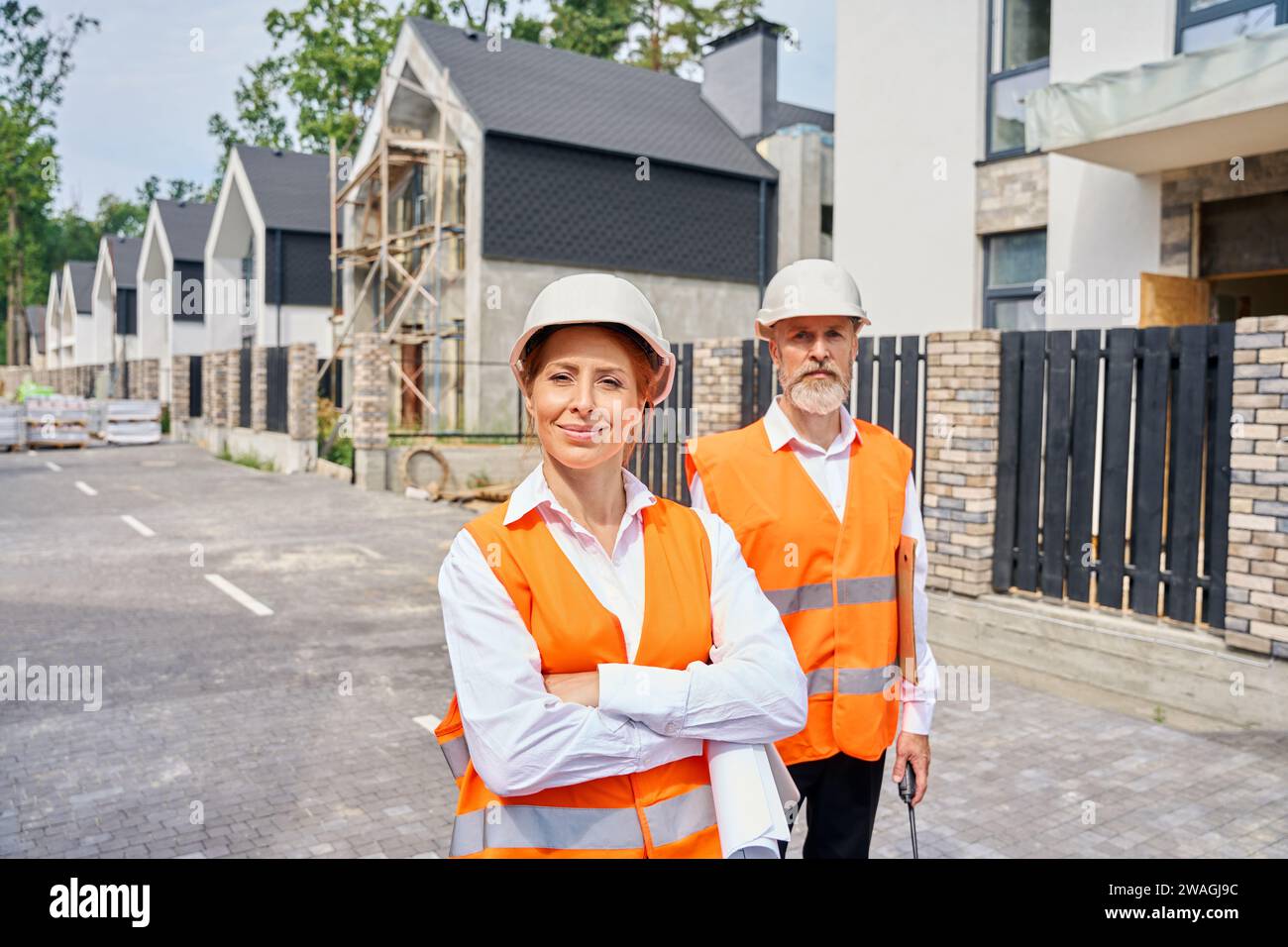 Team of building inspectors conducting inspection of housing complex ...