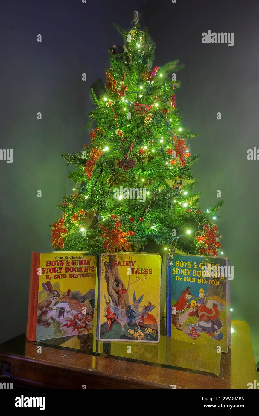 Vintage books and Christmas tree Stock Photo - Alamy