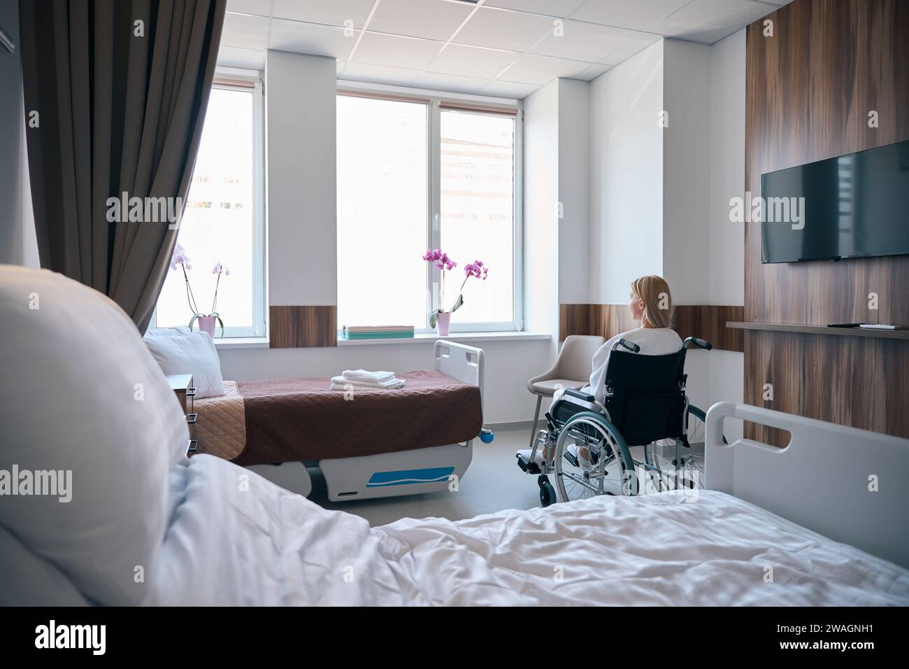 Female with disability in inpatient facility room Stock Photo - Alamy