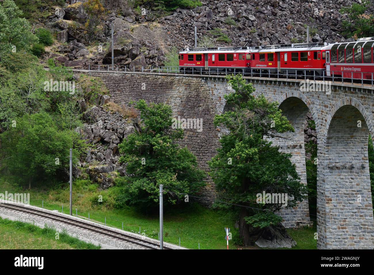 Bernina Express crossing the Brusio spiral viaduct on its way to Tirano ...