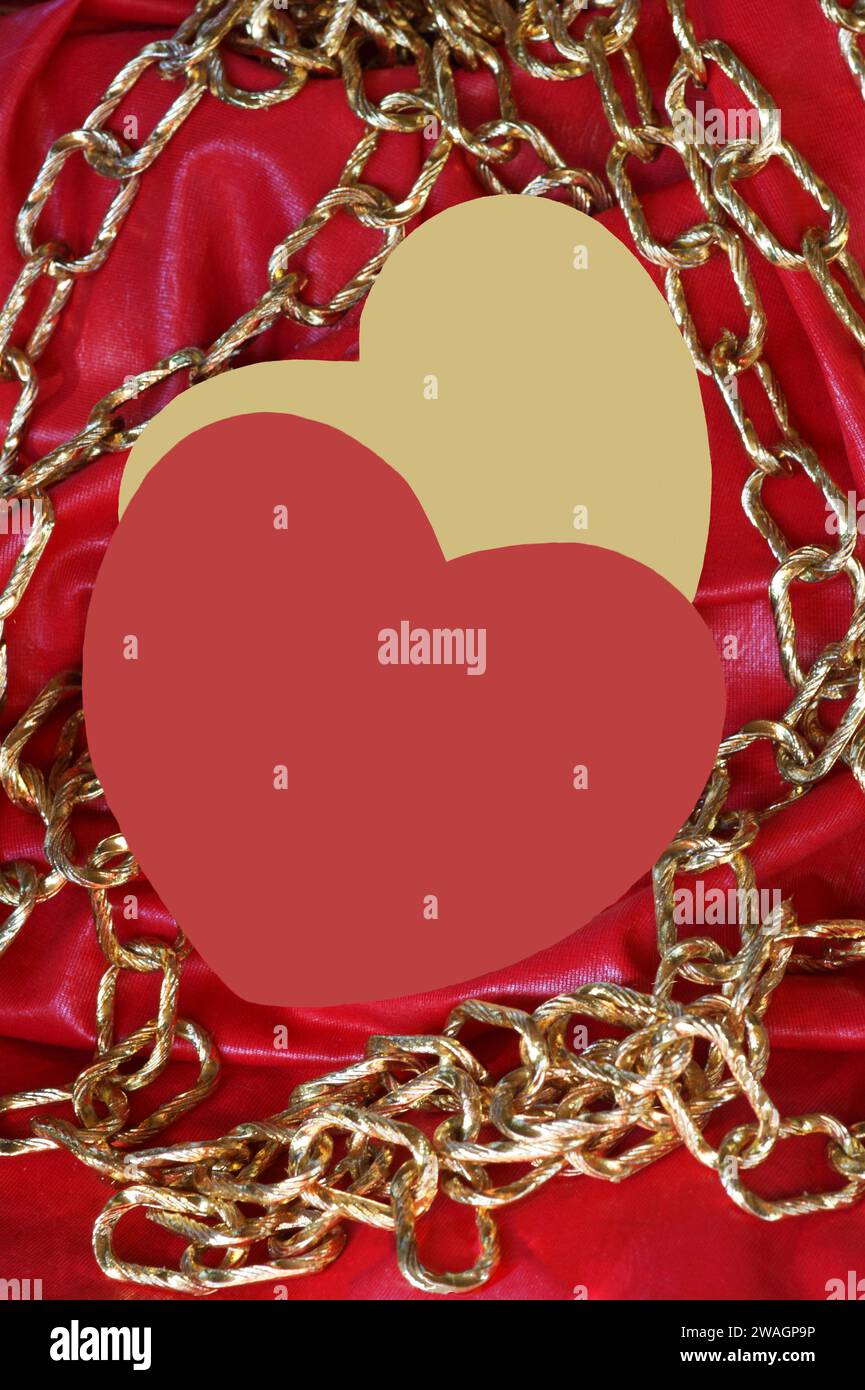 Two valentine hearts surrounded by gold chain and red fabric are ready ...