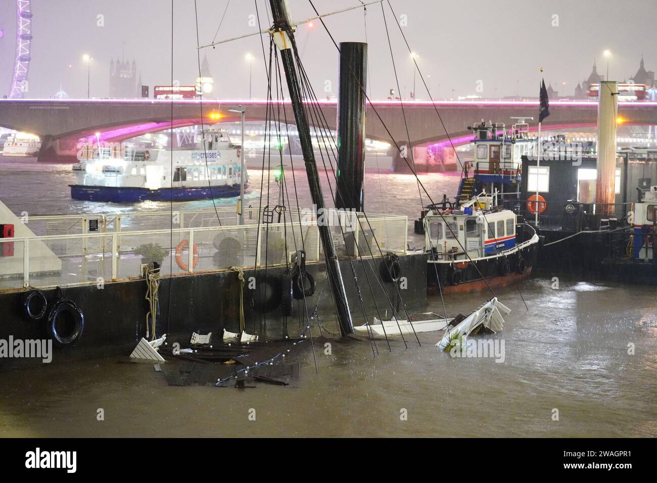 The mast of the Bar & Co boat, which was moored at Temple Pier juts ...