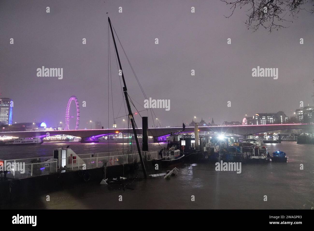 The mast of the Bar & Co boat, which was moored at Temple Pier juts ...