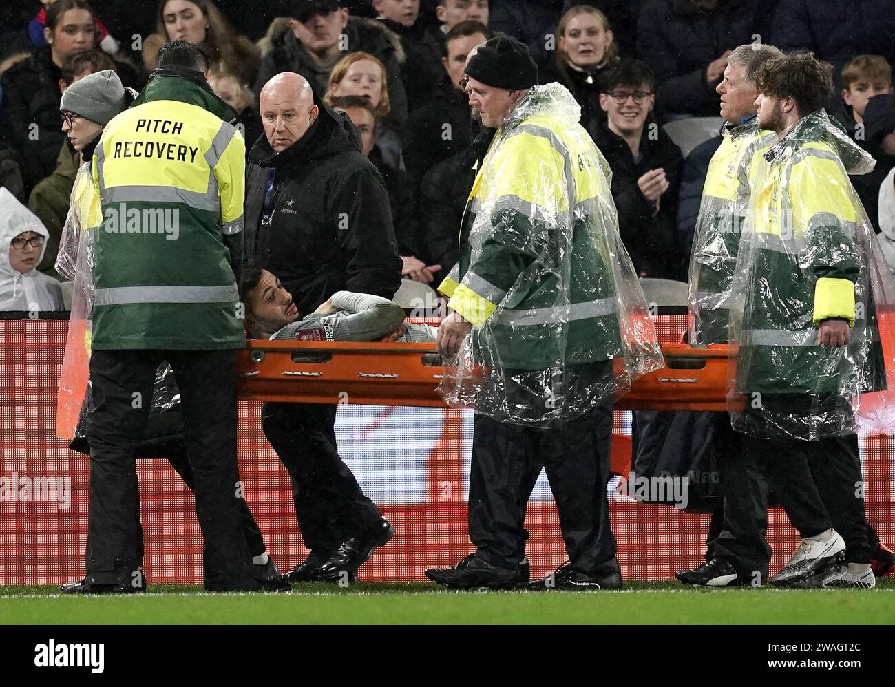Everton's Dwight McNeil leaves the game on a stretcher after picking up ...
