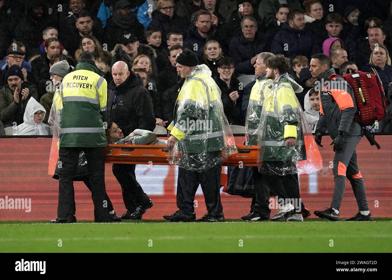 Everton's Dwight McNeil leaves the game on a stretcher after picking up ...
