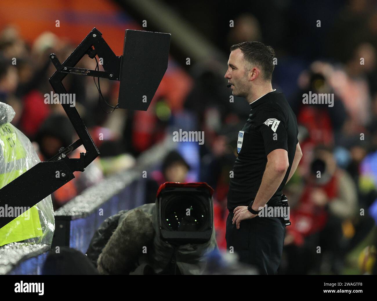 London, UK. 4th Jan, 2024. Referee Chris Kavanagh looks at the pitch ...