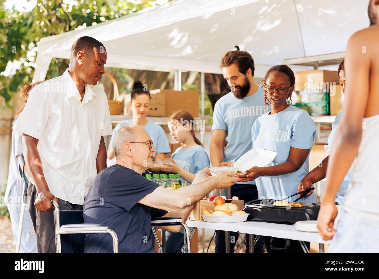 Man woman in wheelchair feeding hi-res stock photography and images - Alamy