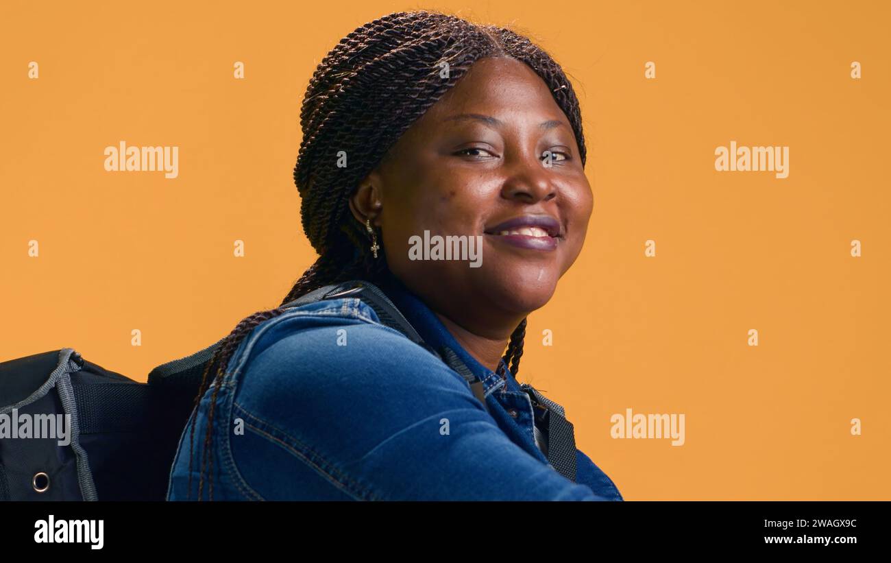 Healthy african american courier with food delivery bag is taking ...