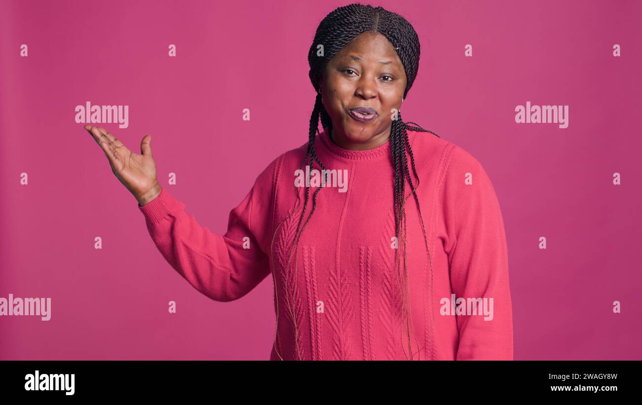 Beautiful African American trendy fashionista with vibrant pink shirt ...