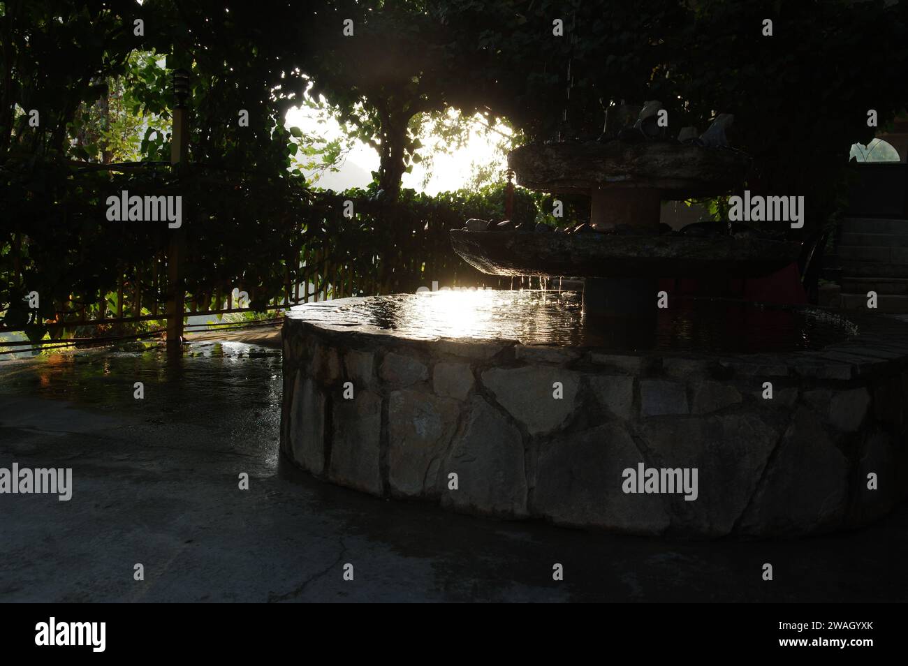 Fountain with light reflection Stock Photo - Alamy