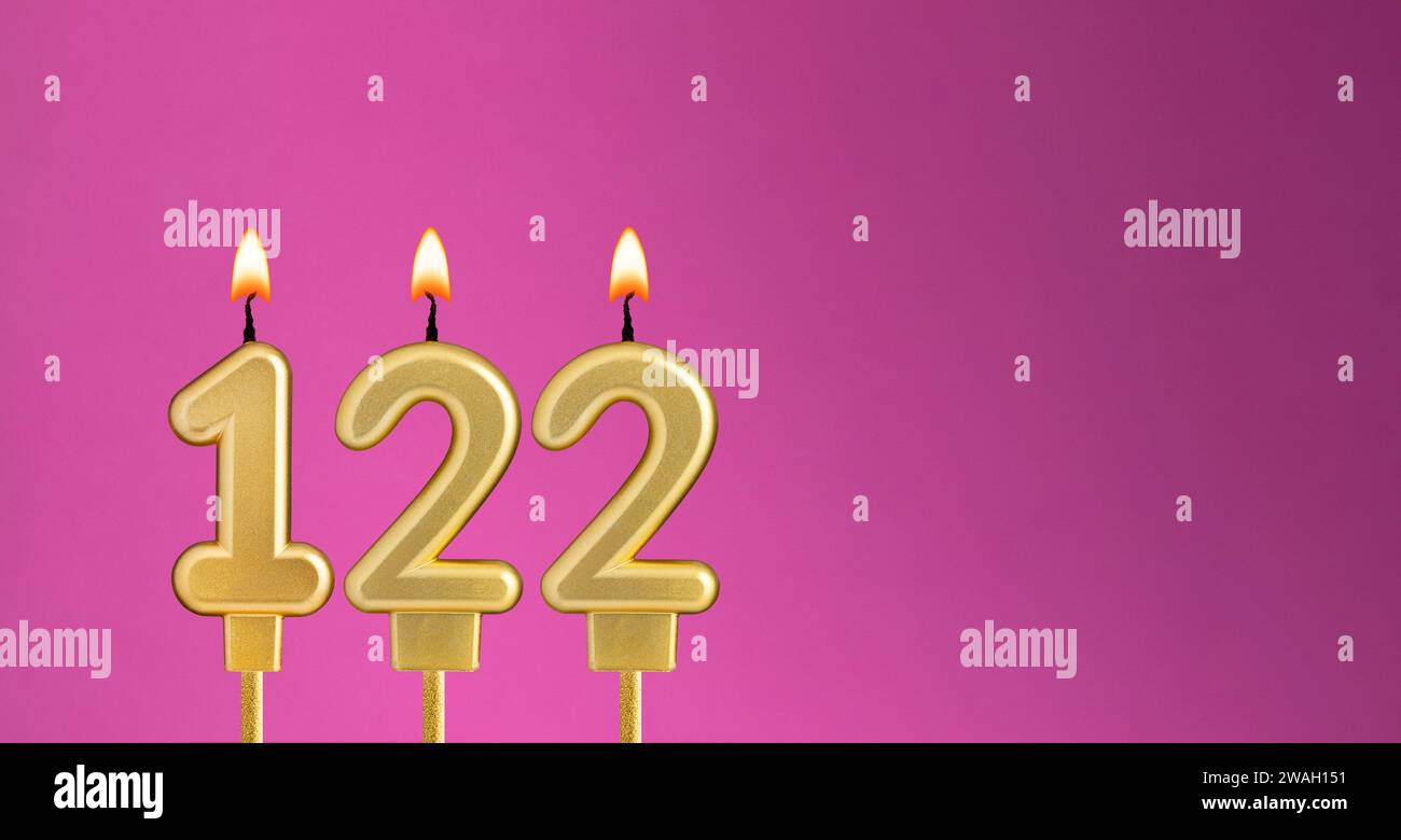 Candle number 122 in purple background - birthday card Stock Photo - Alamy