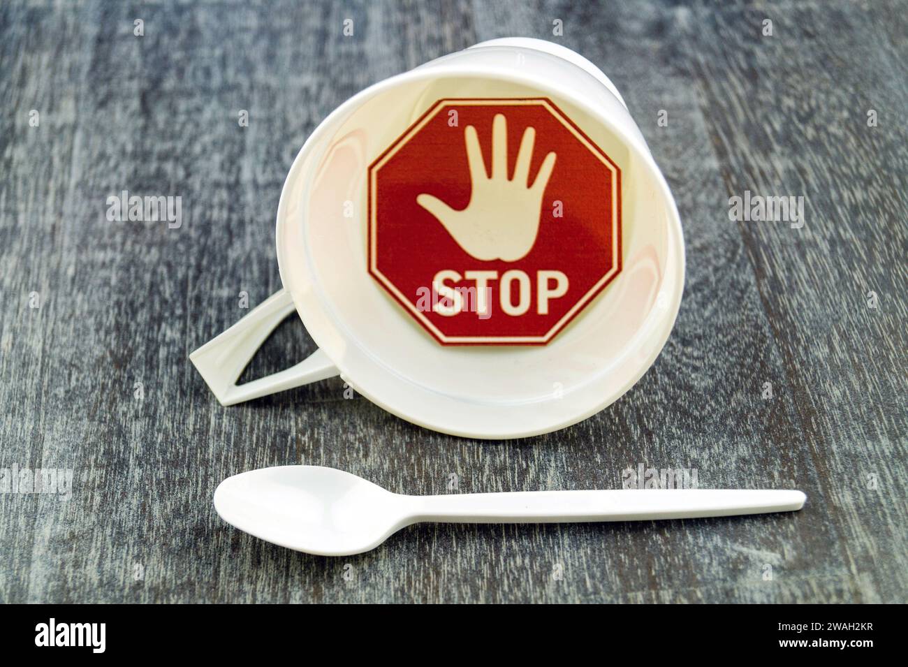 single-use tableware, plastic cutlery and stop sign, symbolic picture ...