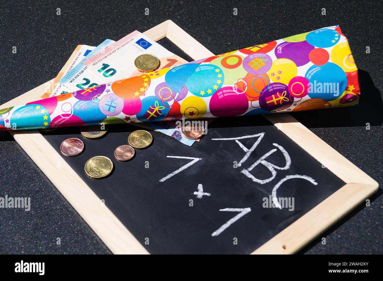 school cone, slate and money, symbolic image for school fees Stock ...