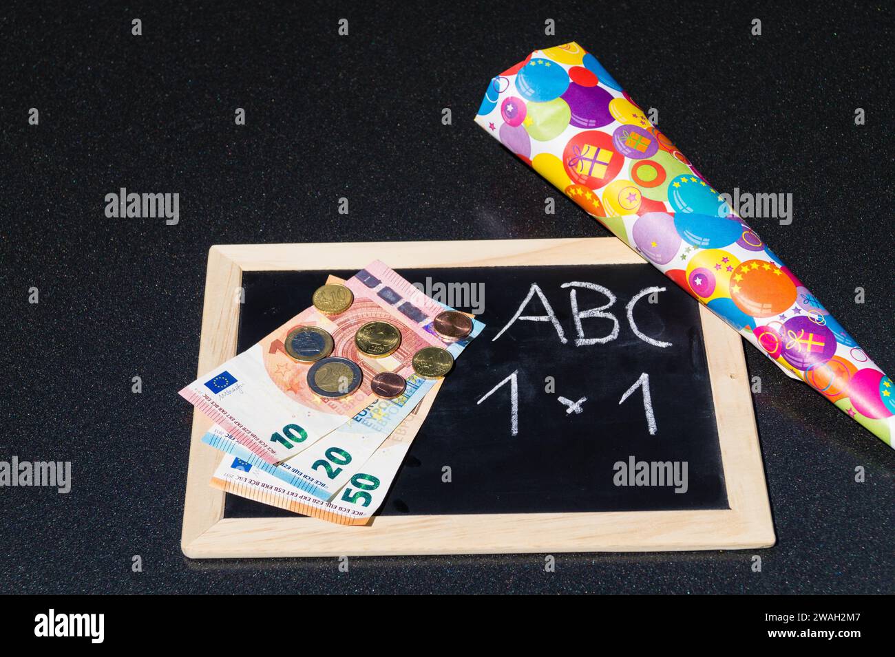 school cone, slate and money, symbolic image for school fees Stock ...