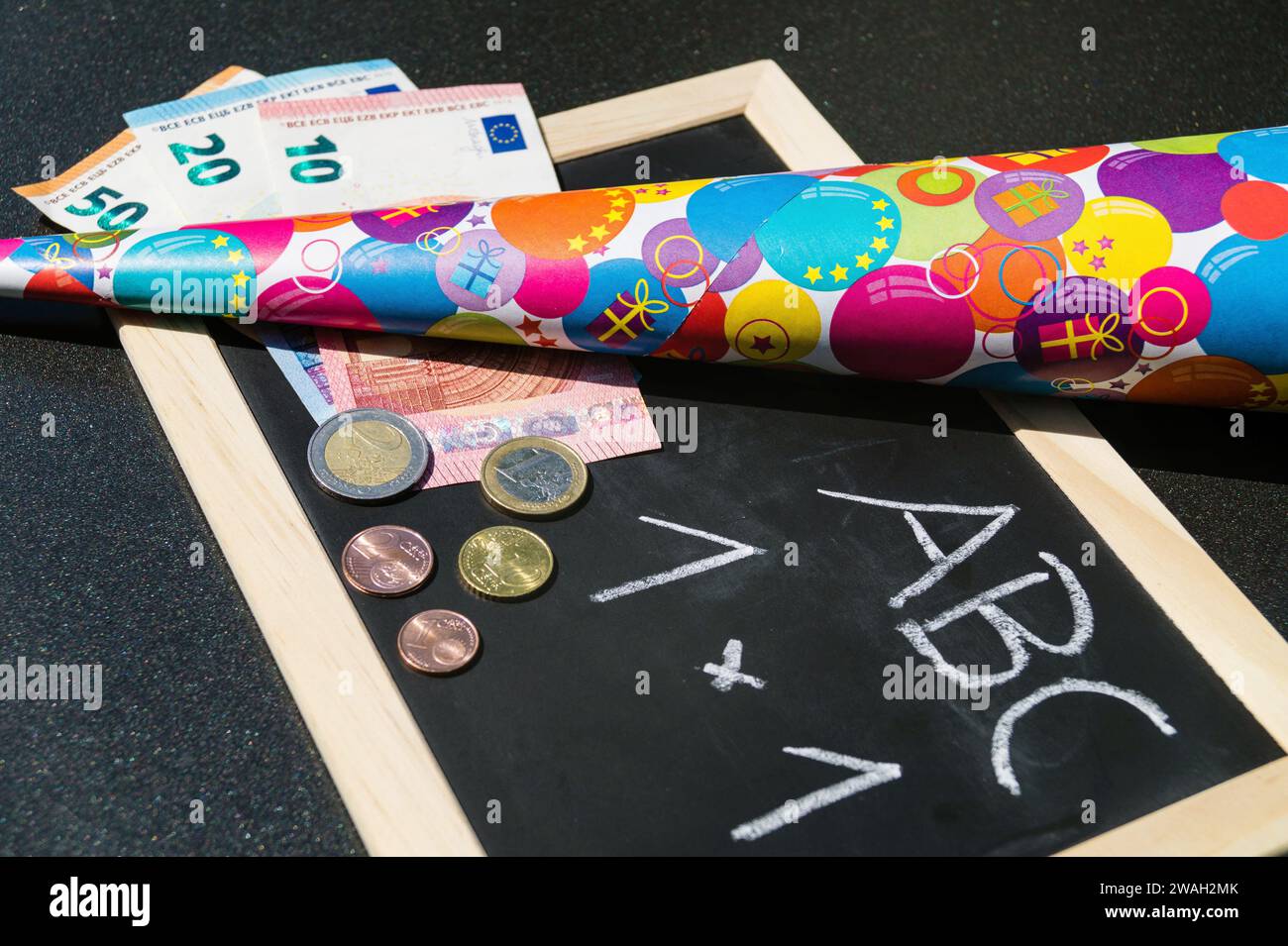 school cone, slate and money, symbolic image for school fees Stock ...