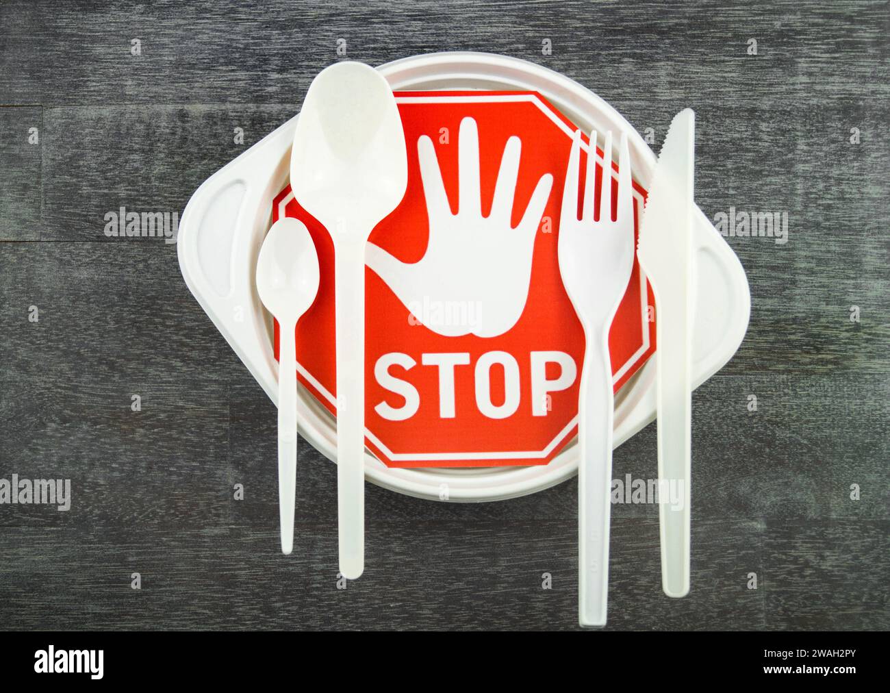 single-use tableware, plastic cutlery and stop sign, symbolic picture ...