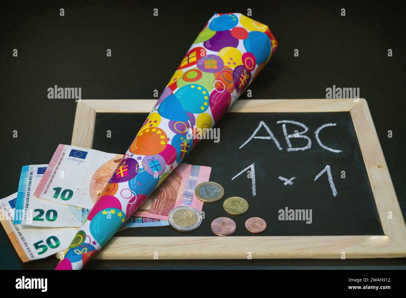 school cone, slate and money, symbolising school fees Stock Photo - Alamy