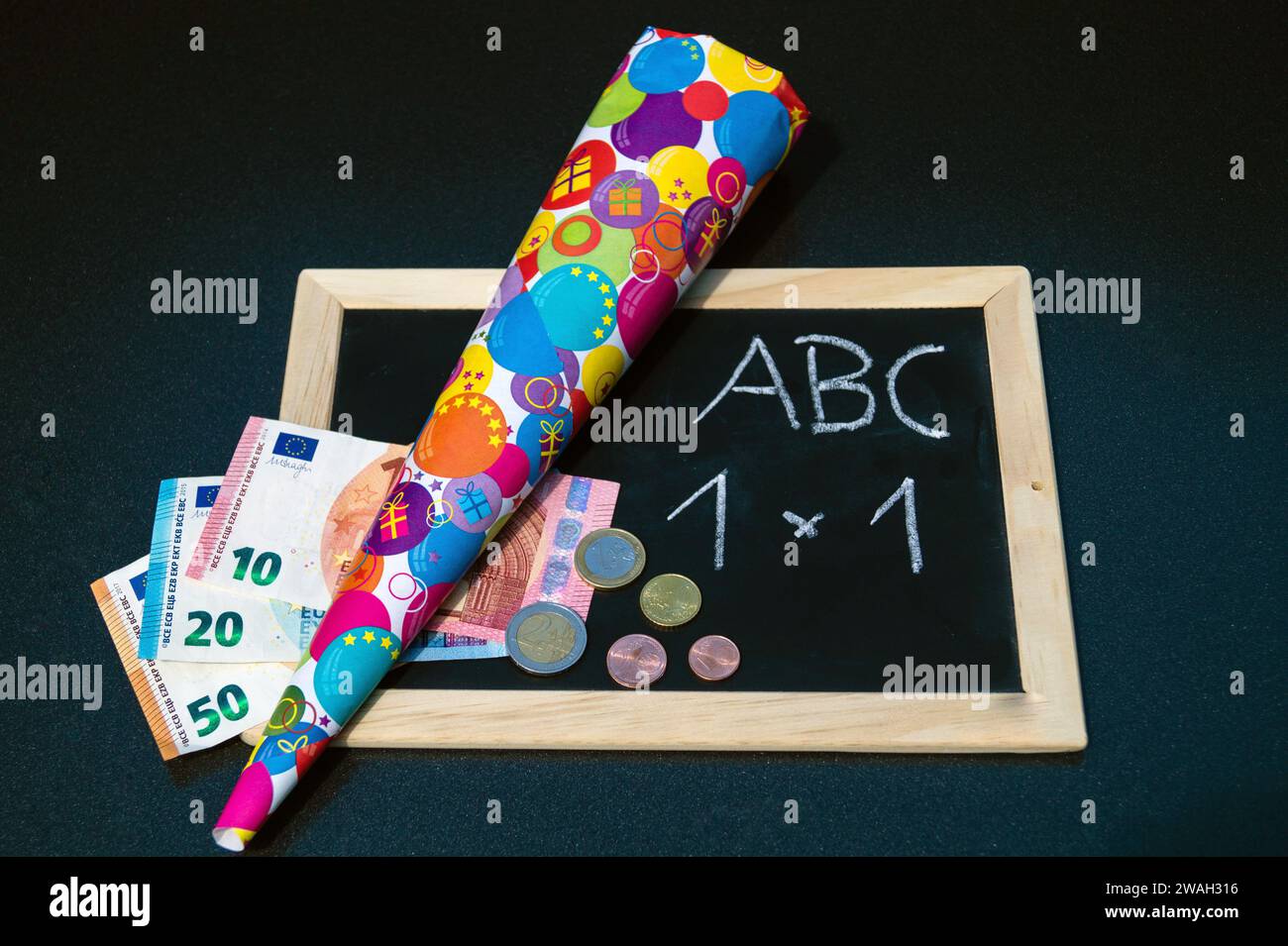 school cone, slate and money, symbolising school fees Stock Photo - Alamy