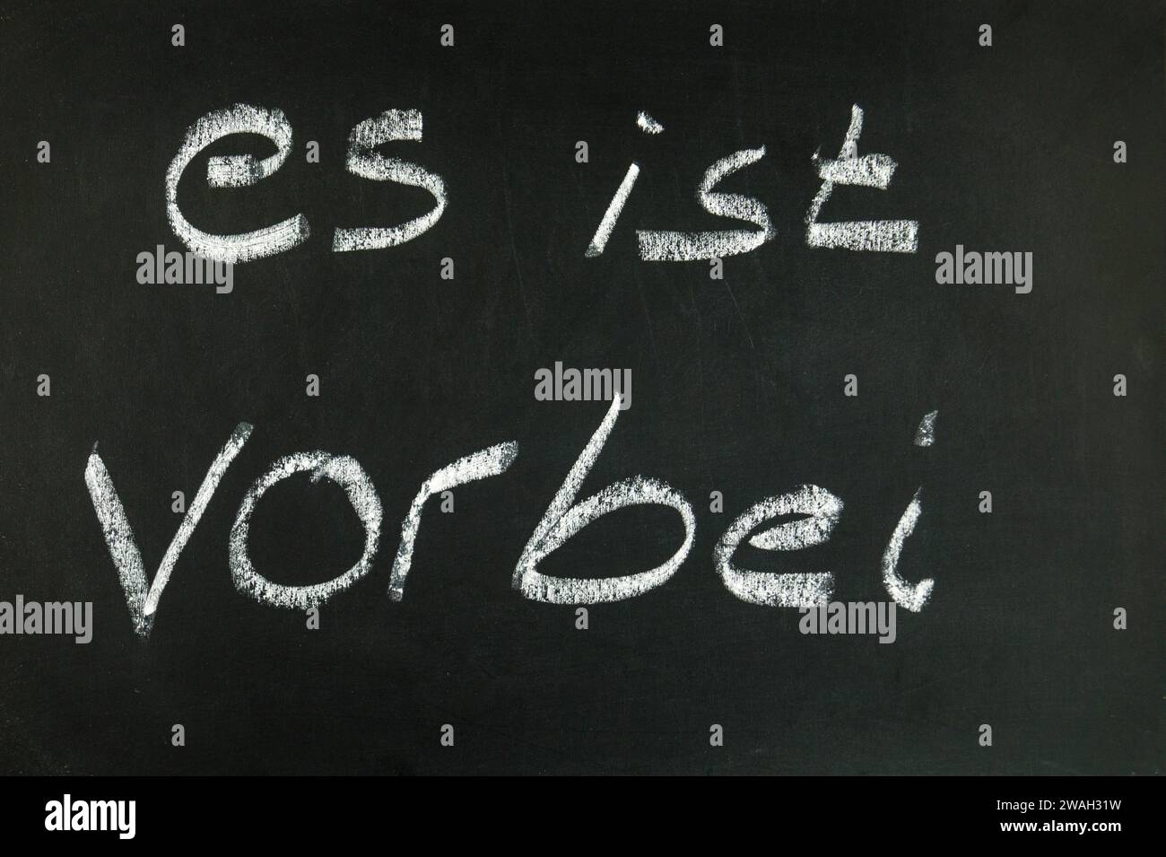 black board with the inscription 'It's over' at the end of a ...