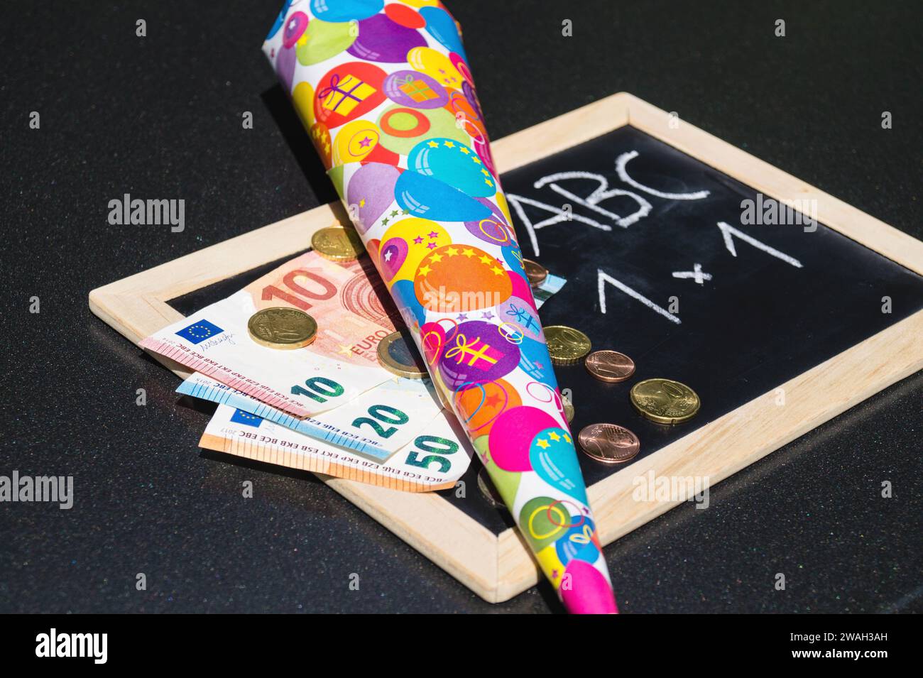 school cone, slate and money, symbolic image for school fees Stock ...