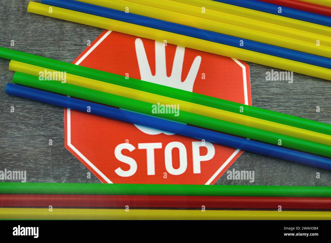 colorful plastic straws on stop sign Stock Photo - Alamy