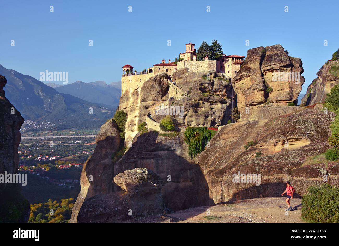 Hiker in front of the monastery of Varlaam, Meteora monasteries, Greece ...