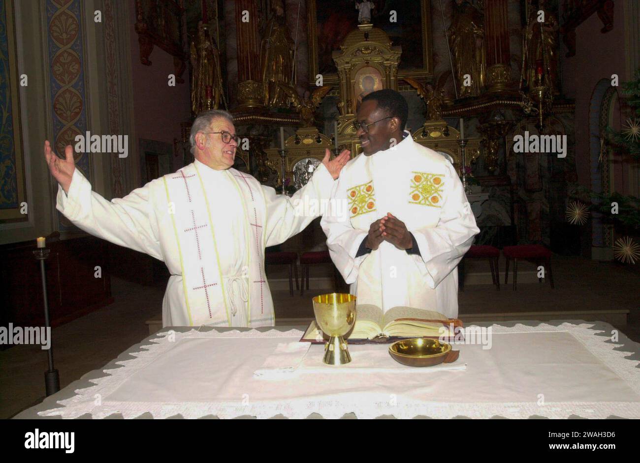 a roman catholic priest, a religious leader in christian religion roman ...