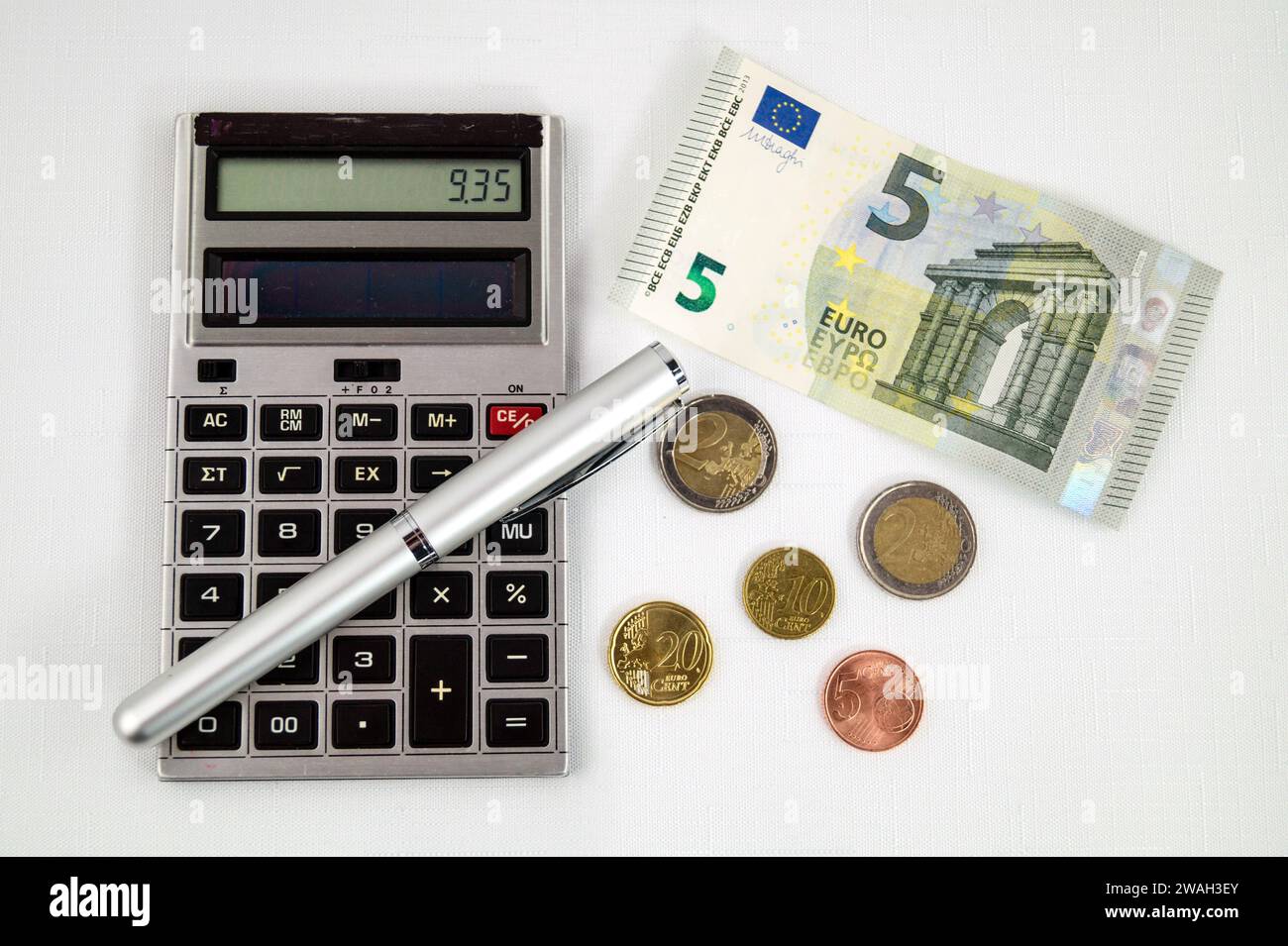 calculator with 9.35 on the display and money, symbol image minimum ...