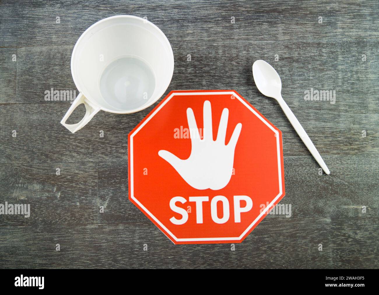 single-use tableware, plastic cutlery and stop sign, symbolic picture ...