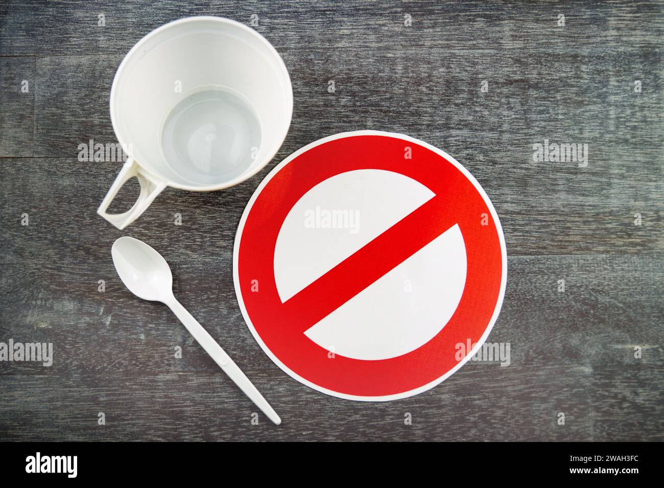 single-use tableware, plastic cutlery and prohibition sign, symbolic ...