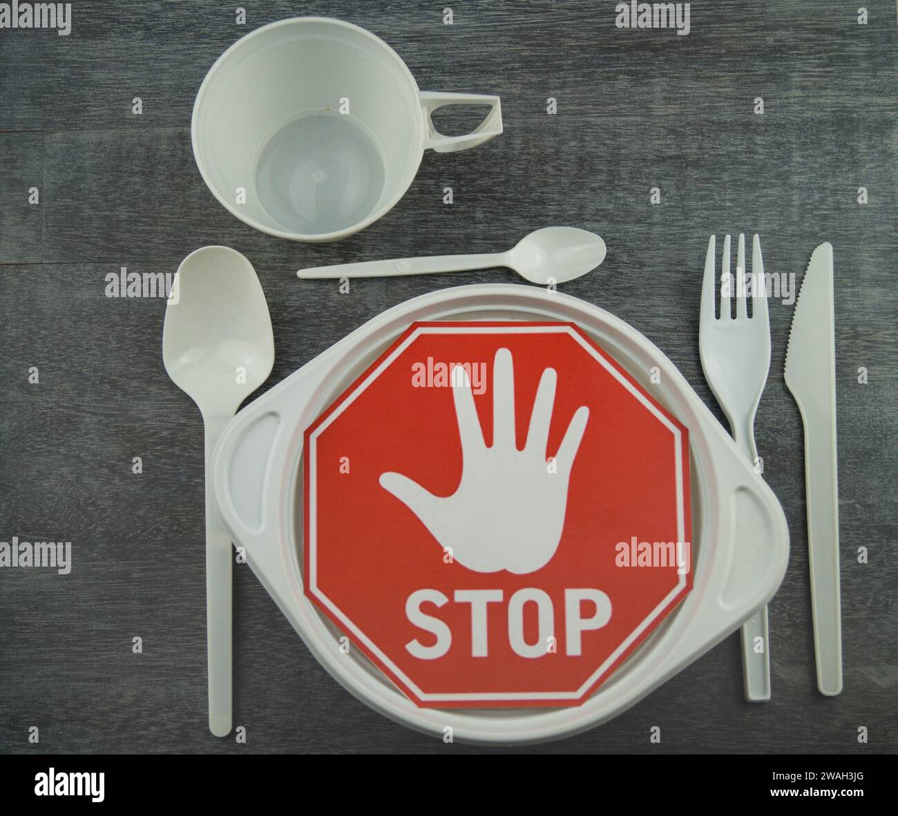 single-use tableware, plastic cutlery and stop sign, symbolic picture ...