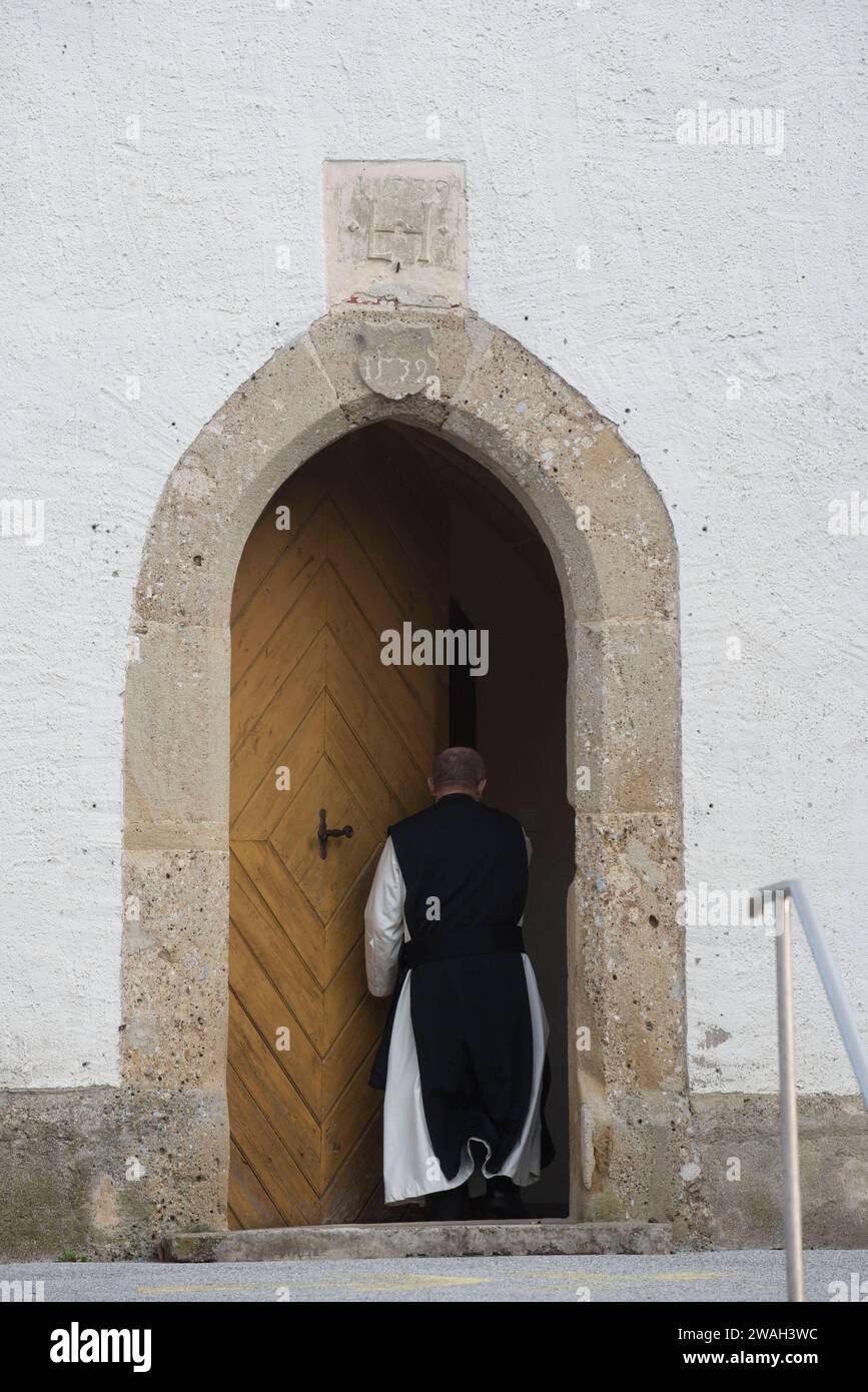 a roman catholic priest, a religious leader in christian religion roman ...