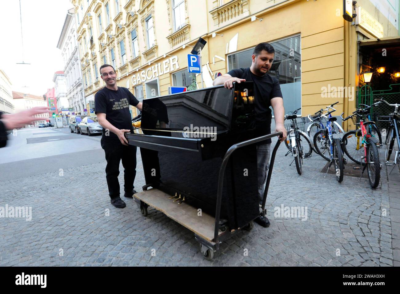 a piano, a stringed keyboard instrument for playing music pieces a ...