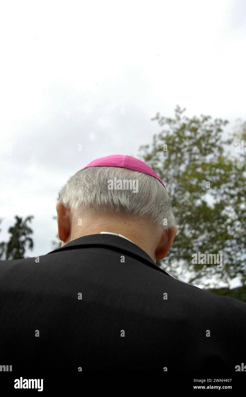 a roman catholic priest, a religious leader in christian religion roman ...
