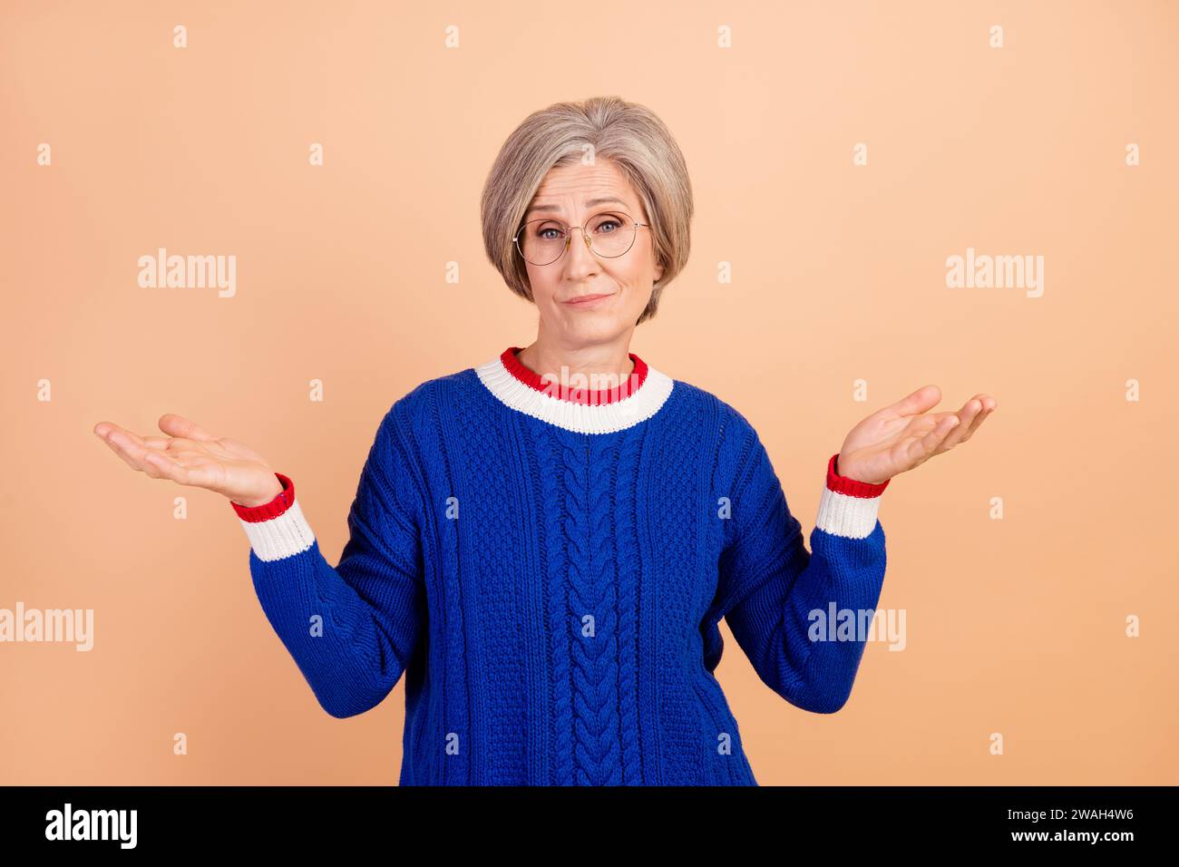 Portrait of clueless indifferent senior woman wear blue jumper in ...