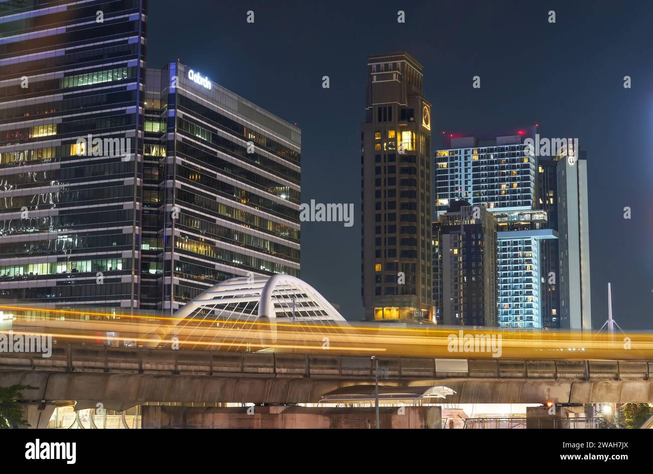 Passing metro train bts on an overpass among skyscrapers at Chong Nonsi ...