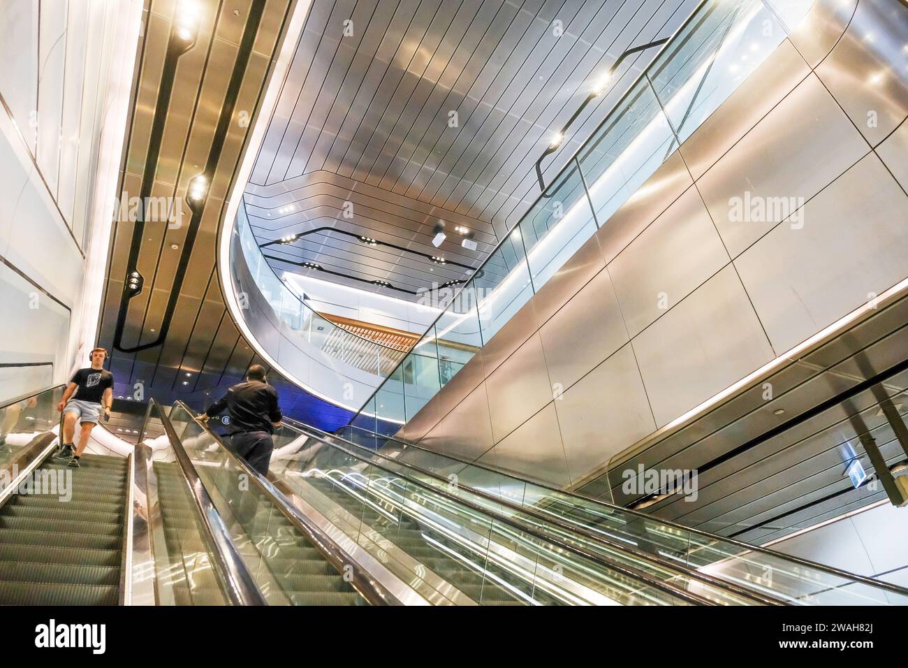 Men travelling up an escalator in Wynyard train station, Sydney, NSW, Australia Stock Photo - Alamy