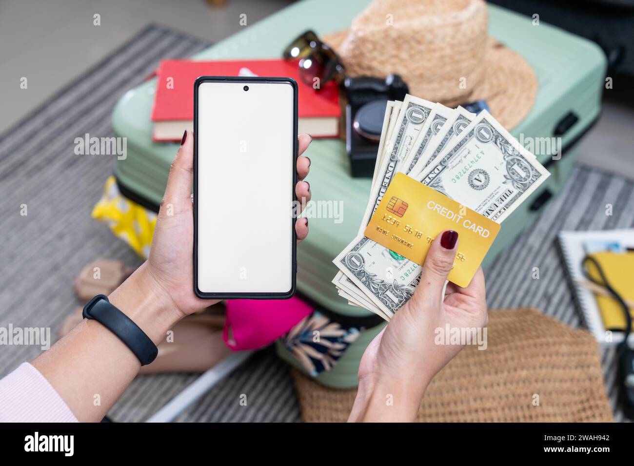 Credit cards and cash ready for travel Stock Photo - Alamy